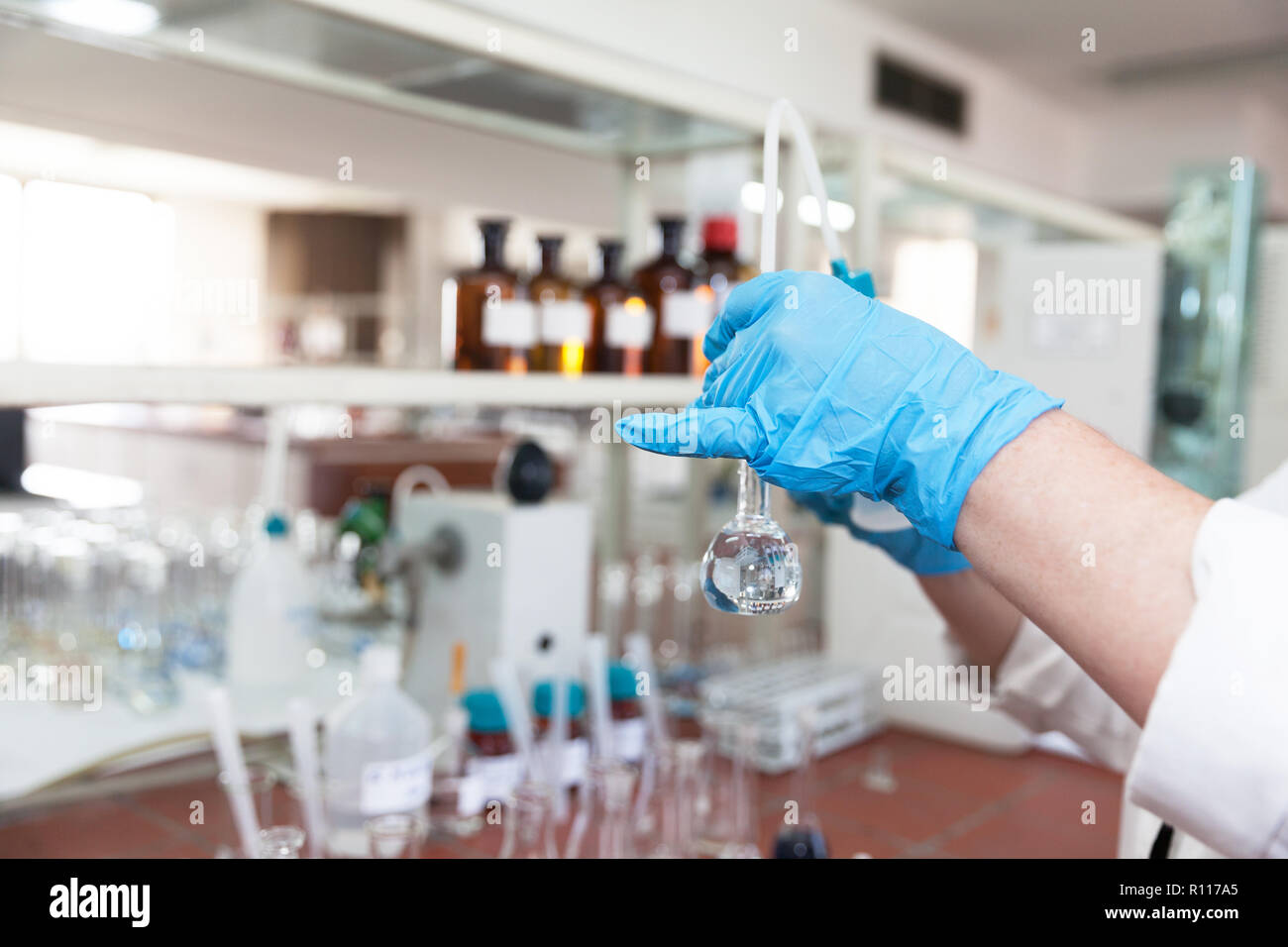 A scientist in laboratory analyzing water sample Stock Photo - Alamy