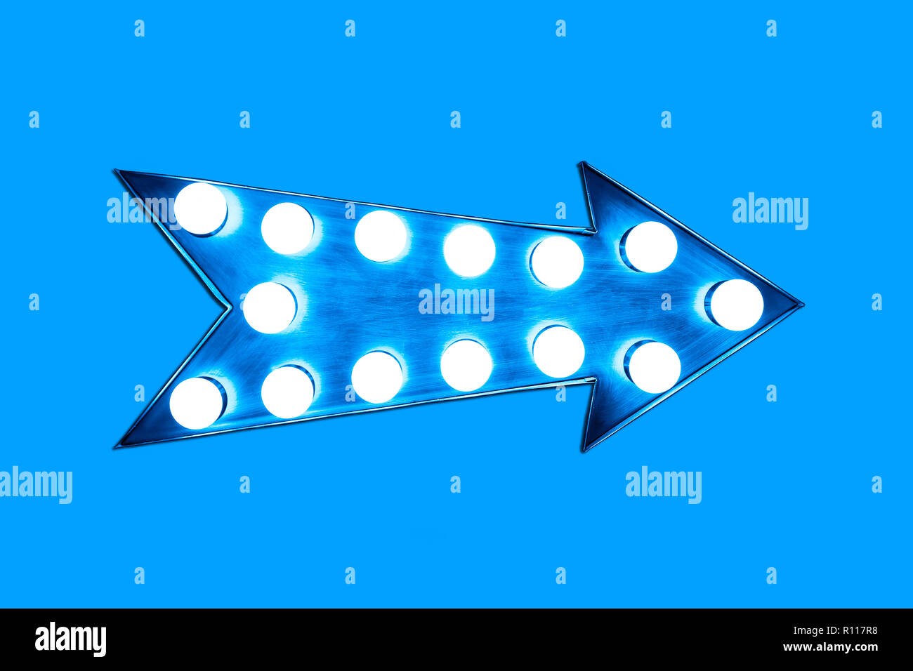 Retro blue arrow shaped vintage colorful illuminated metallic display ...