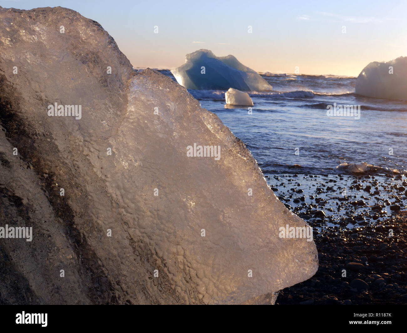 Ice bergs on Diamond Beach in Iceland. Sunny days and light breaking ...
