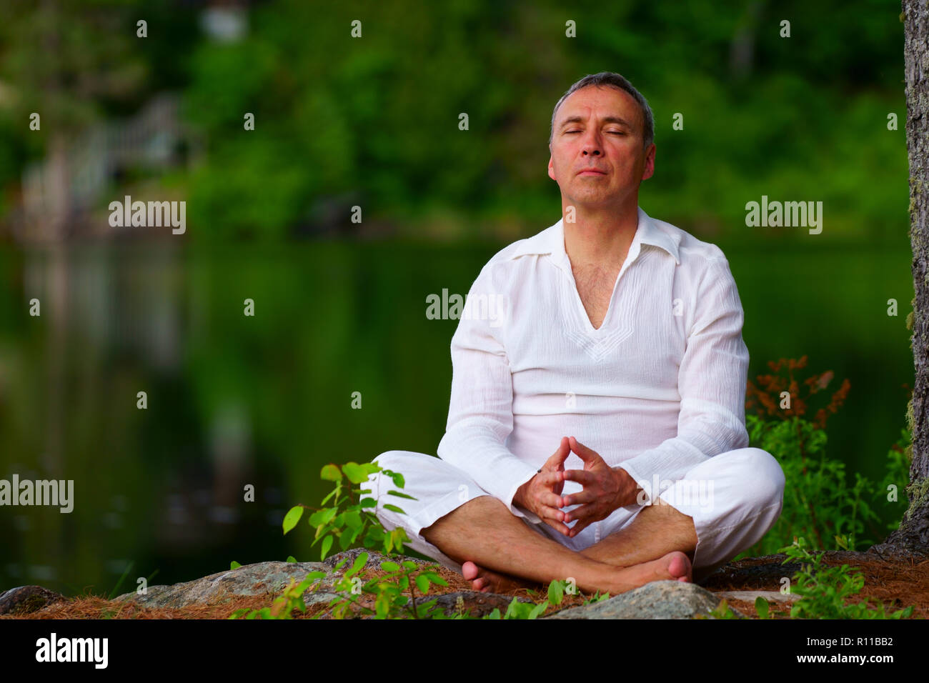 Man meditating outdoors hi-res stock photography and images - Alamy