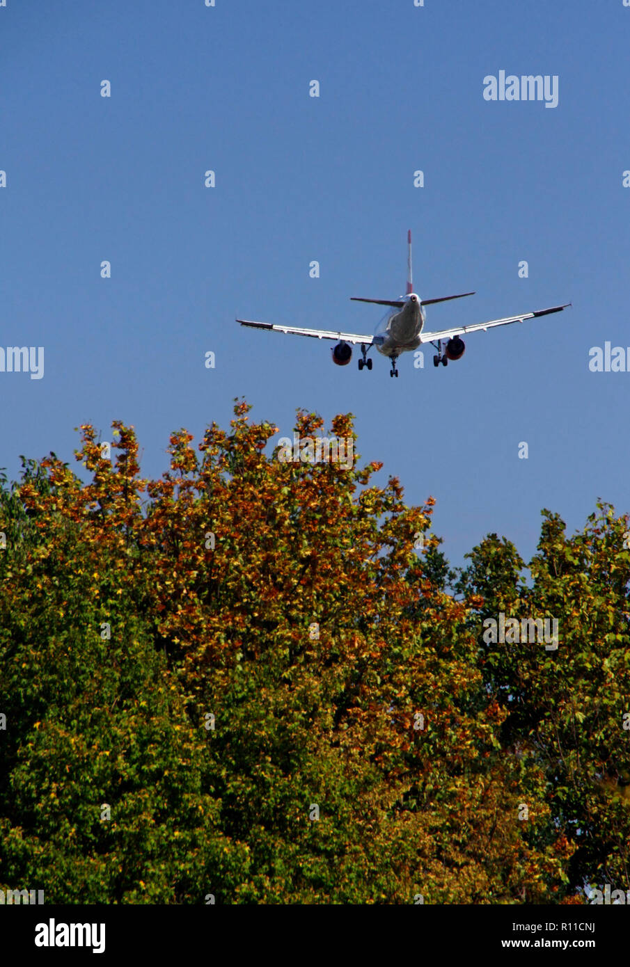 Aircraft noise - low-flying air plane during its approach Stock Photo ...
