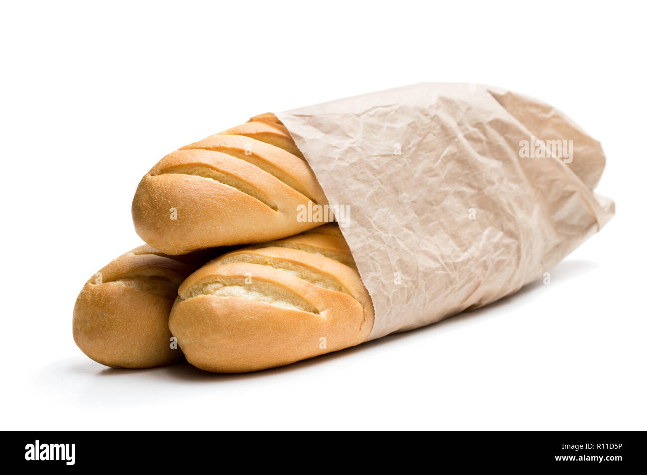 Delicious baguettes in paper bag isolated on white Stock Photo - Alamy