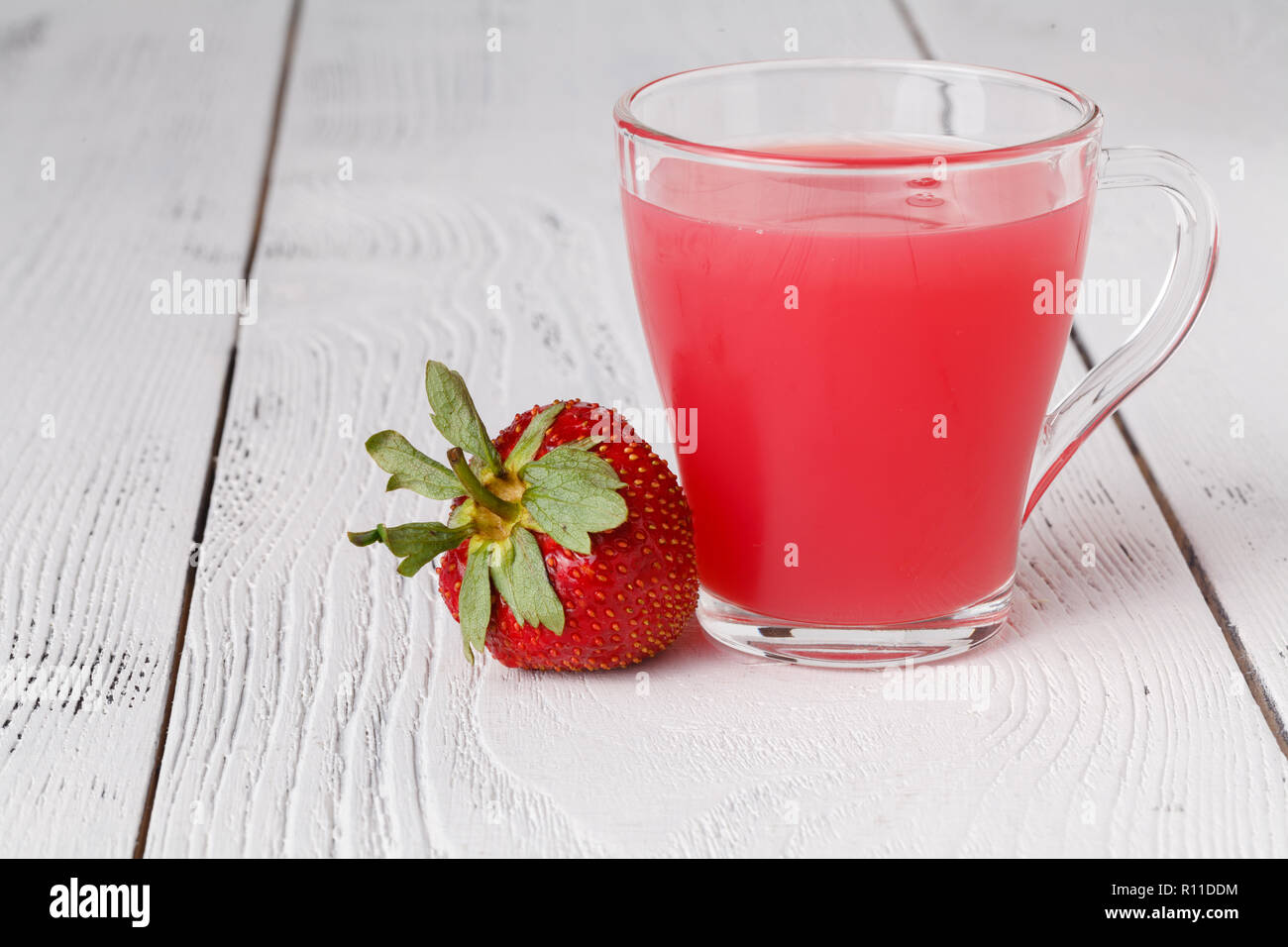 Berry liquid pudding with strawberry Stock Photo - Alamy