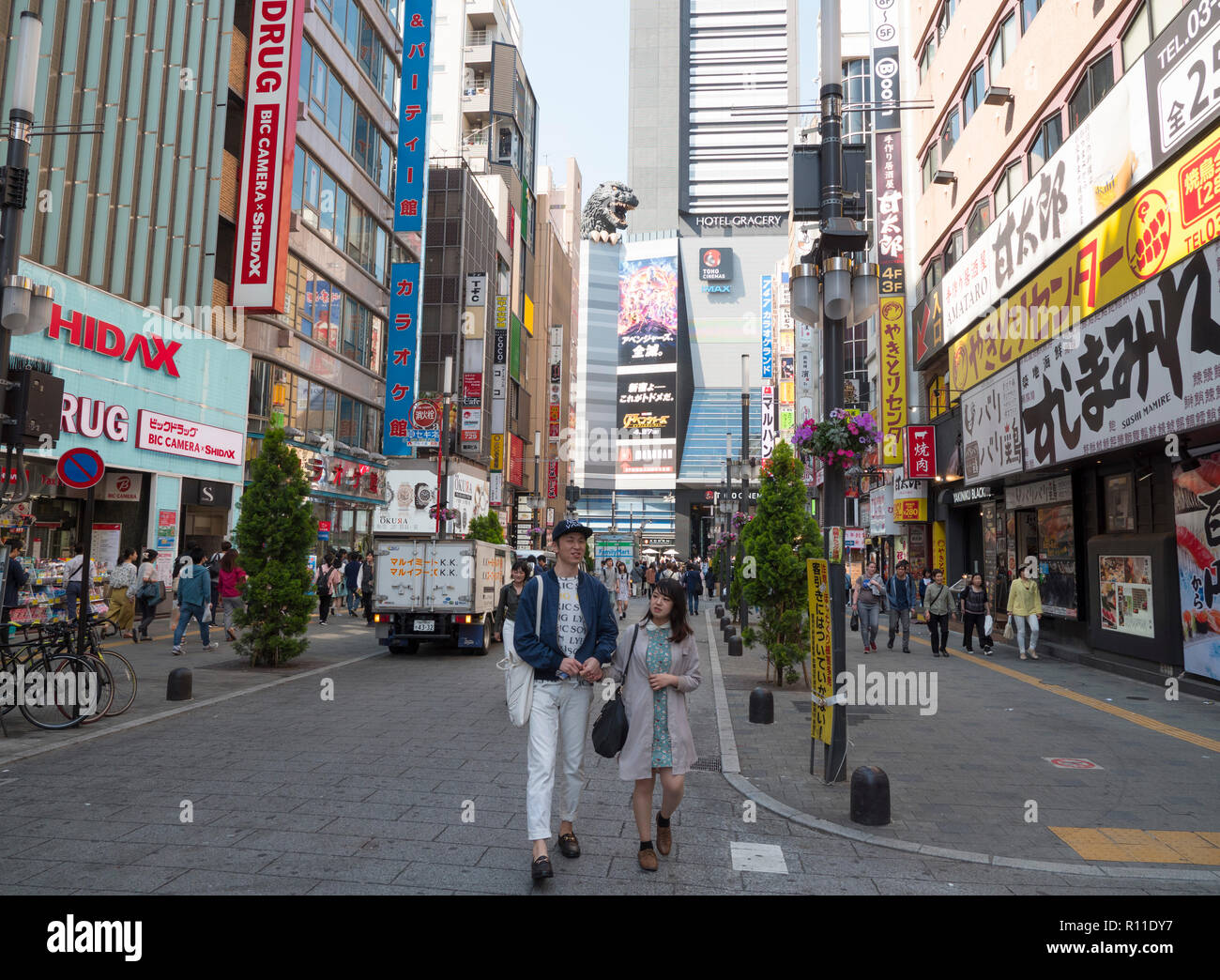 People walk through the Shinjuku area of Tokyo, Japan Stock Photo - Alamy