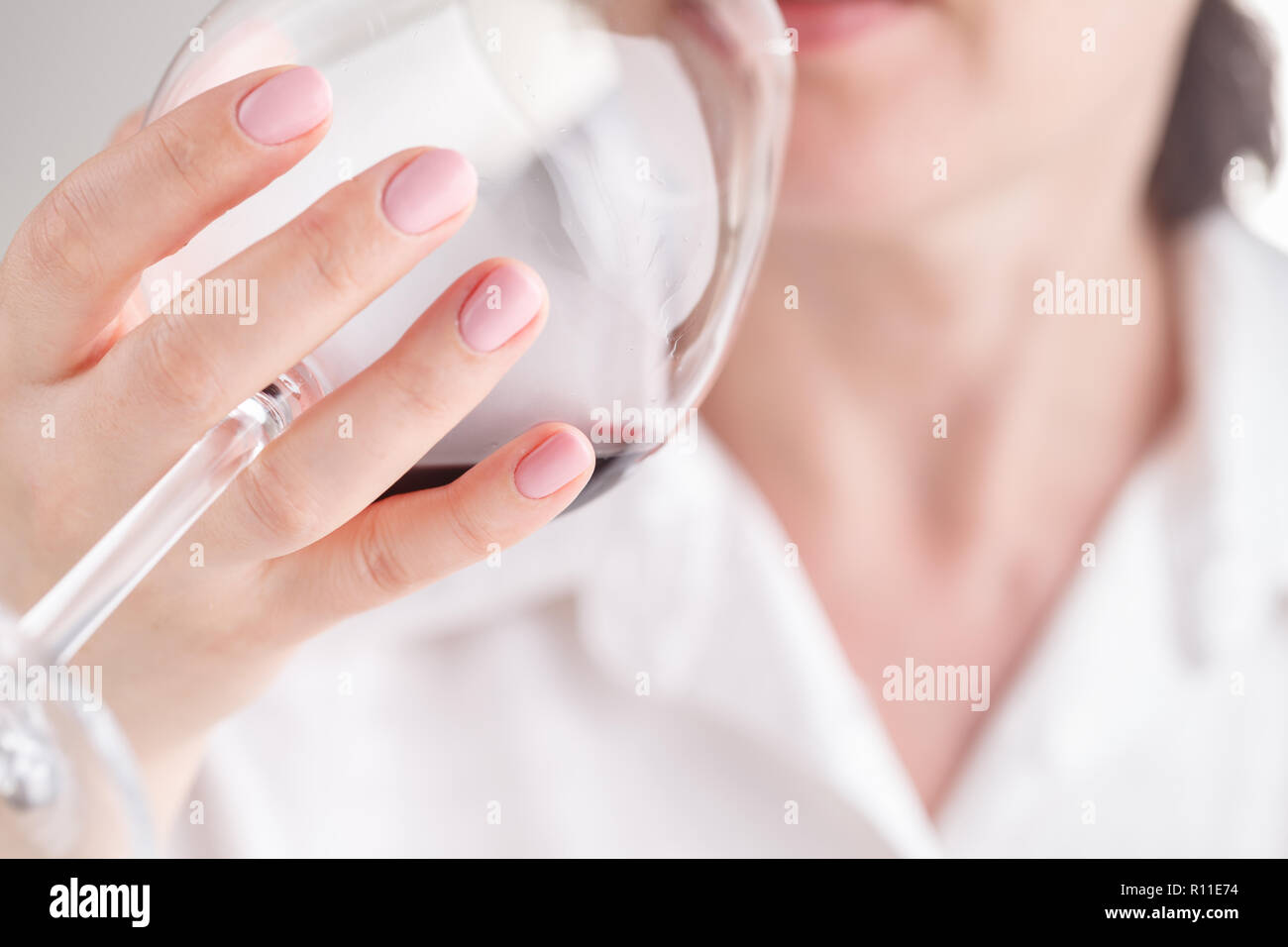 Beautiful young woman smelling feeling aroma drinking with pleasure ...