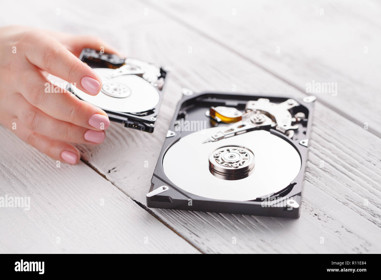Hard disk drive in hands hi-res stock photography and images - Alamy