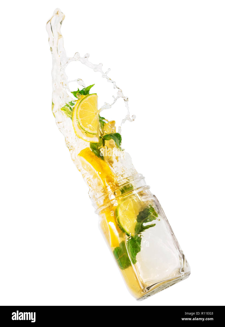 Lemonade splash with lemons and mint flying out of jar Stock Photo - Alamy