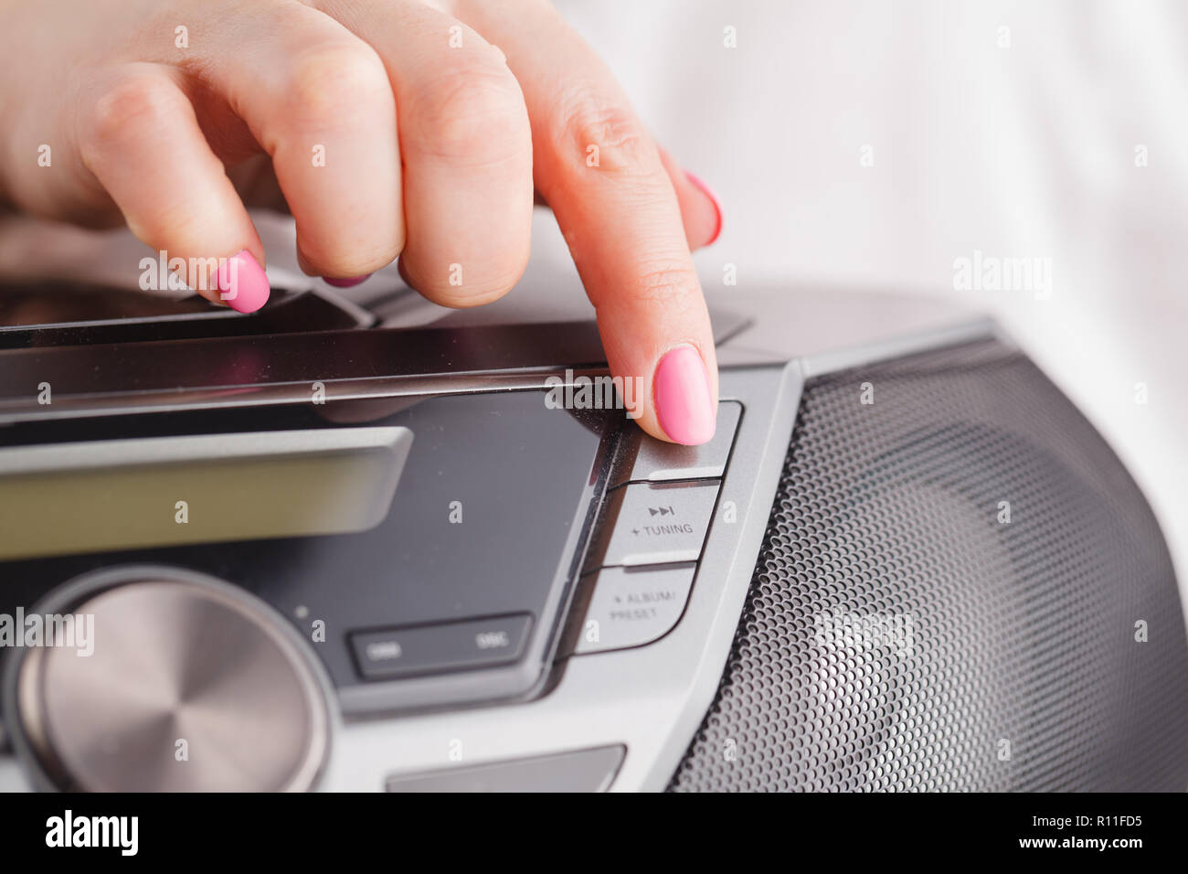 Press play button on audio system Stock Photo - Alamy