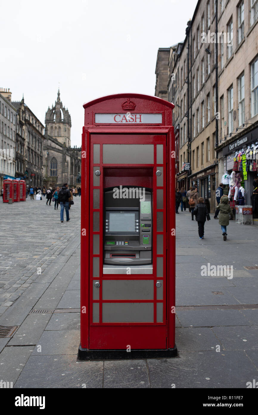 A red telephone box turned into a cash atm point on the Royal Mile ...
