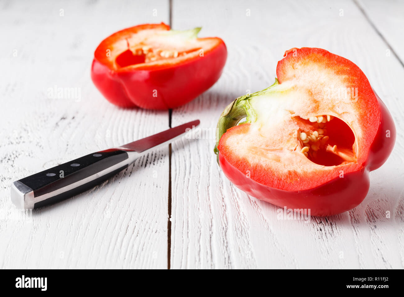 Bulgarian pepper and one half of pepper on table Stock Photo - Alamy