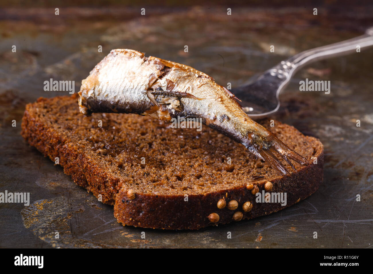 Under salt anchovies with slice of bread Stock Photo - Alamy