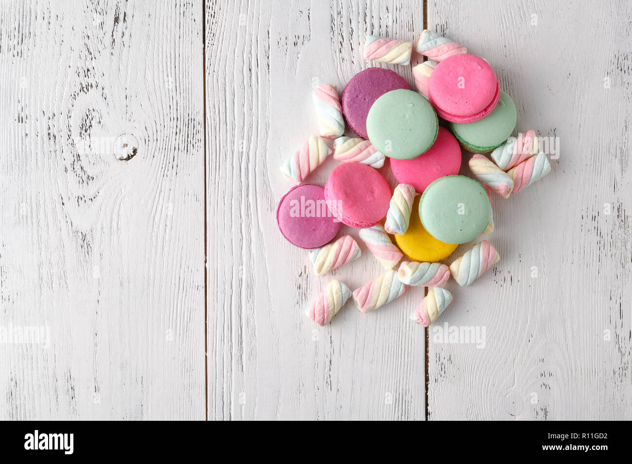Pile of sweets on table corner Stock Photo - Alamy