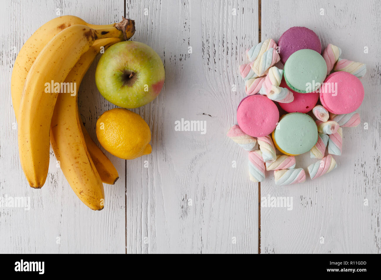 choice fruits vs sweets Stock Photo - Alamy