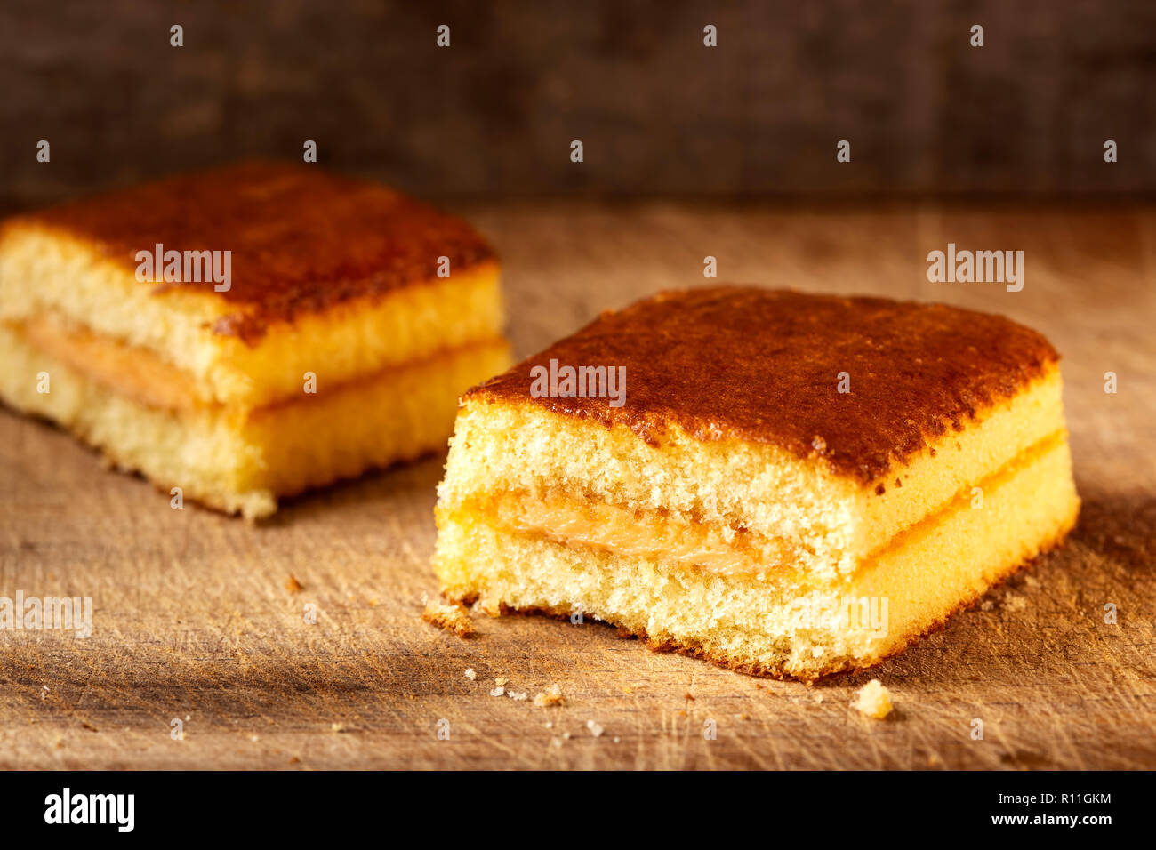 Sponge cookie with fruit cream - close up view Stock Photo - Alamy