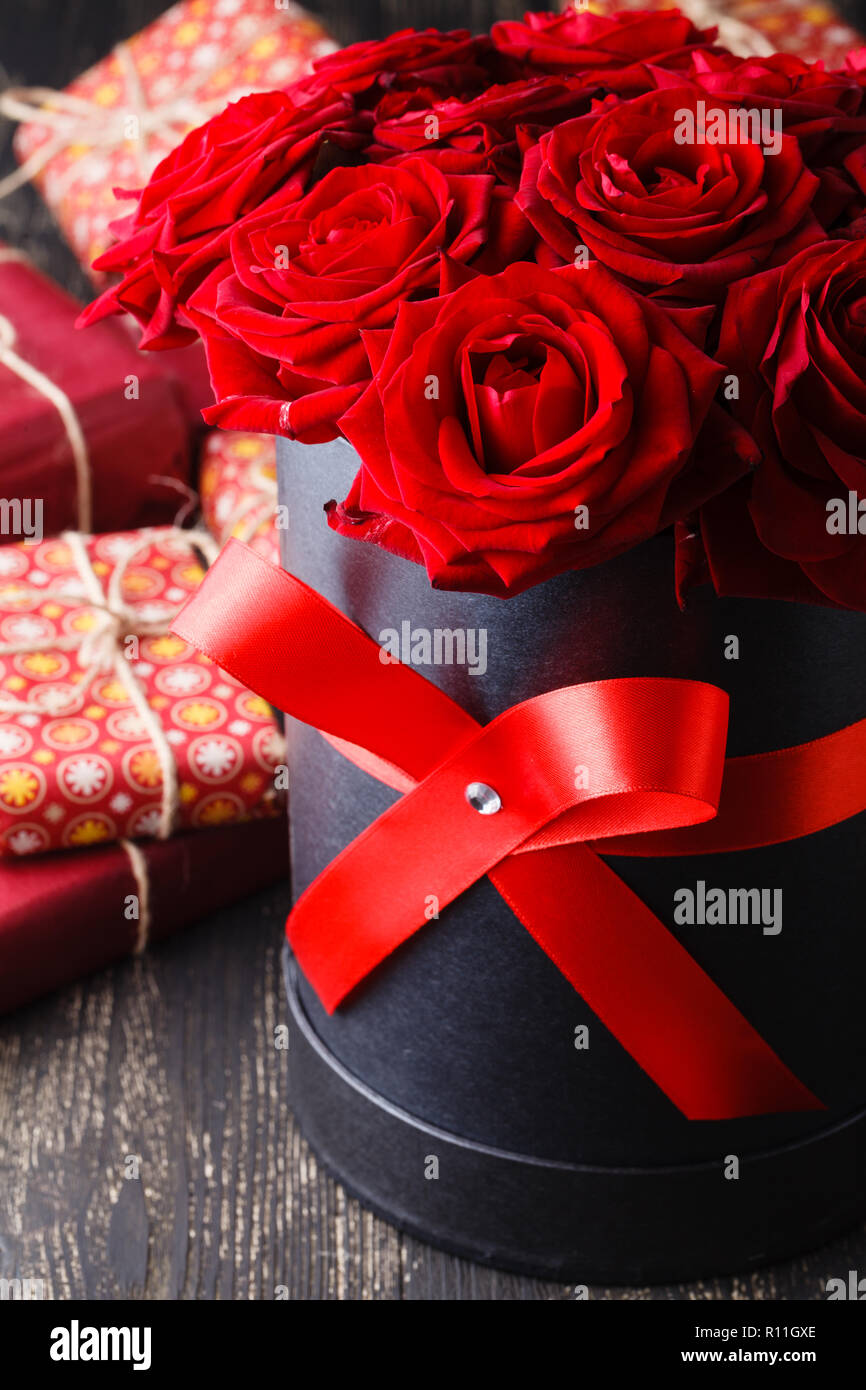 Red roses in box on dark background Stock Photo - Alamy