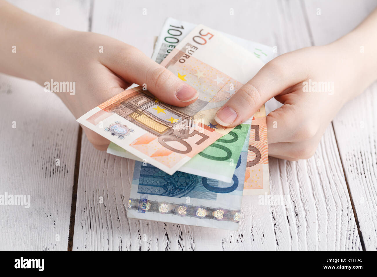 Euro banknotes money in female hands Stock Photo - Alamy