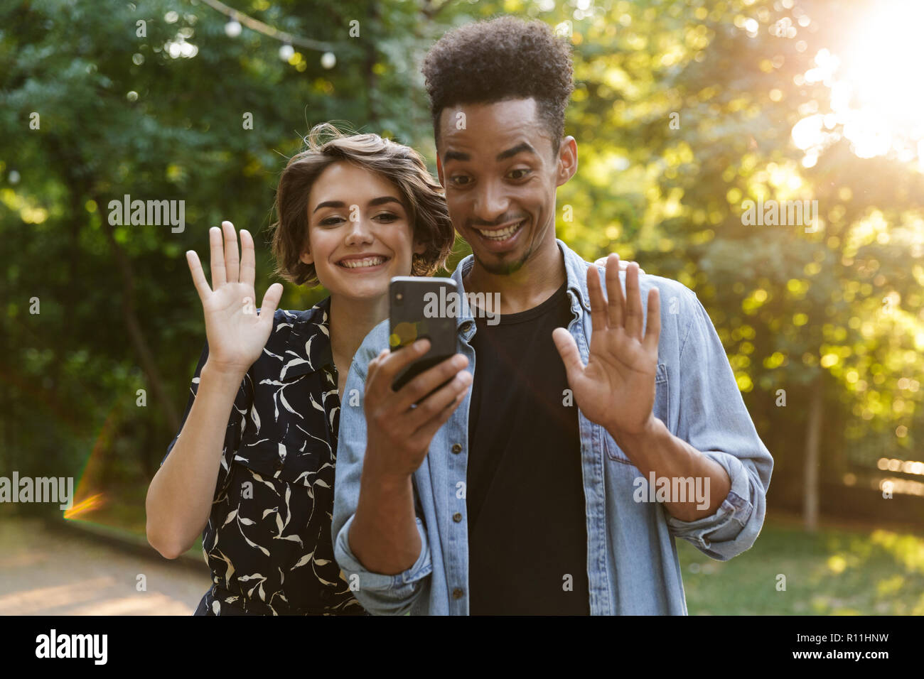 Male to female teenager waving hi-res stock photography and images - Alamy
