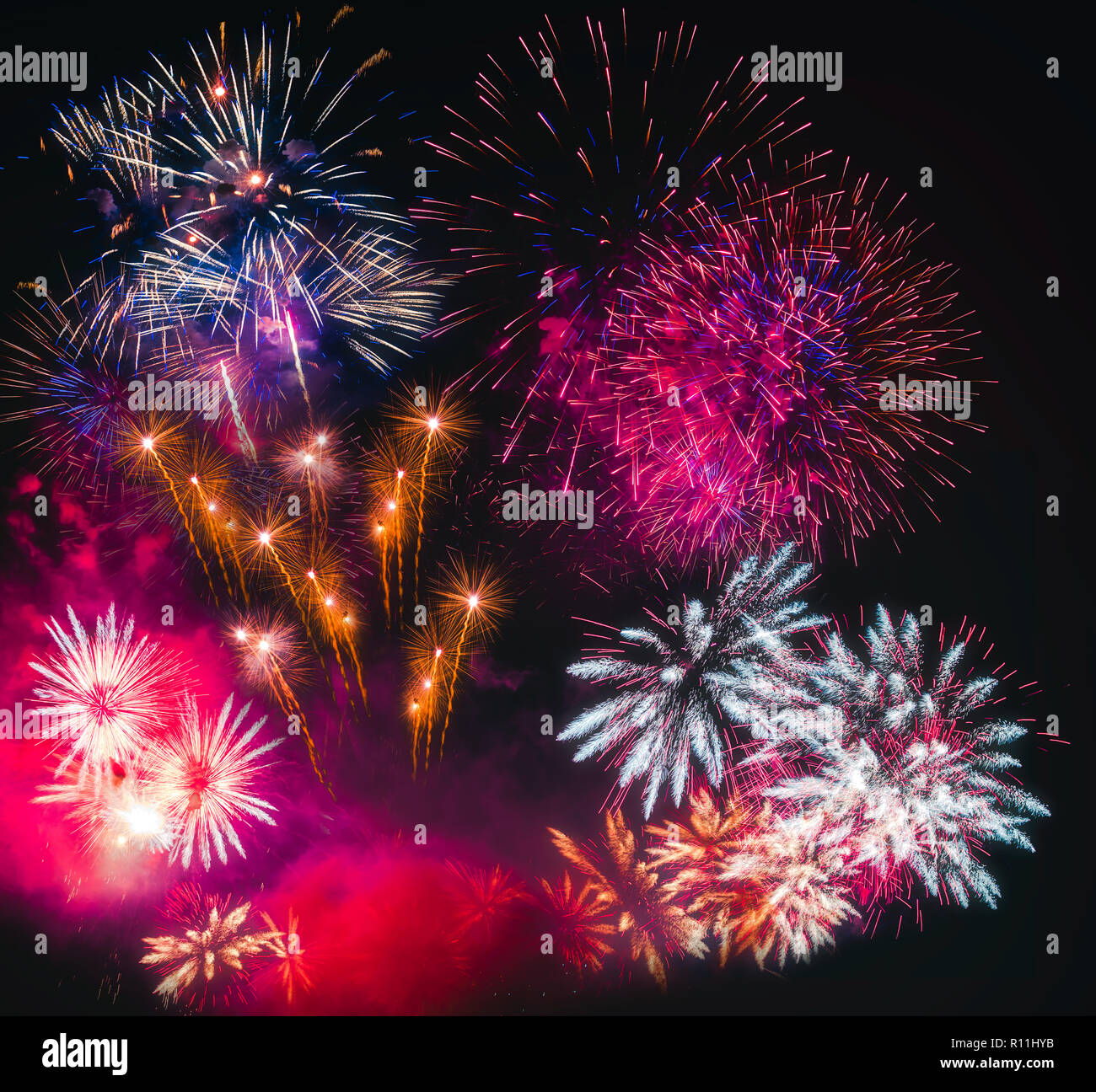 Colorful fireworks explosion on the black background Stock Photo - Alamy
