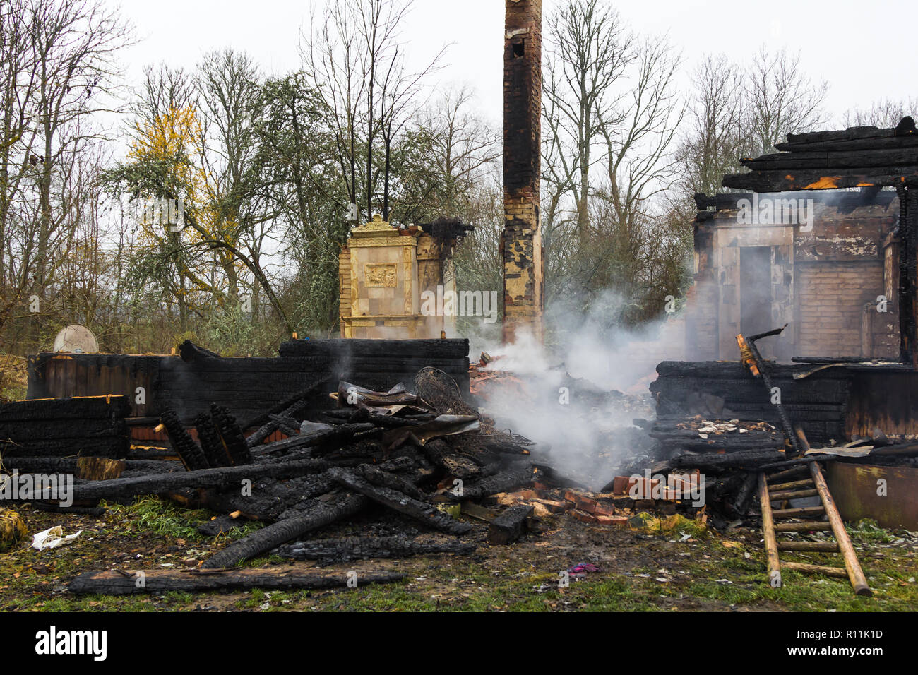 charred wooden parts of a burnt house in Latvia on November Stock Photo ...