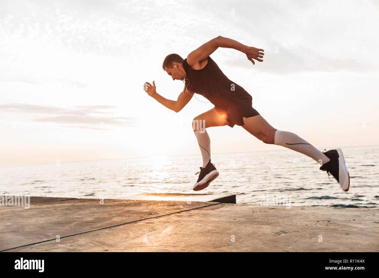 Back view young sportsman running hi-res stock photography and images ...