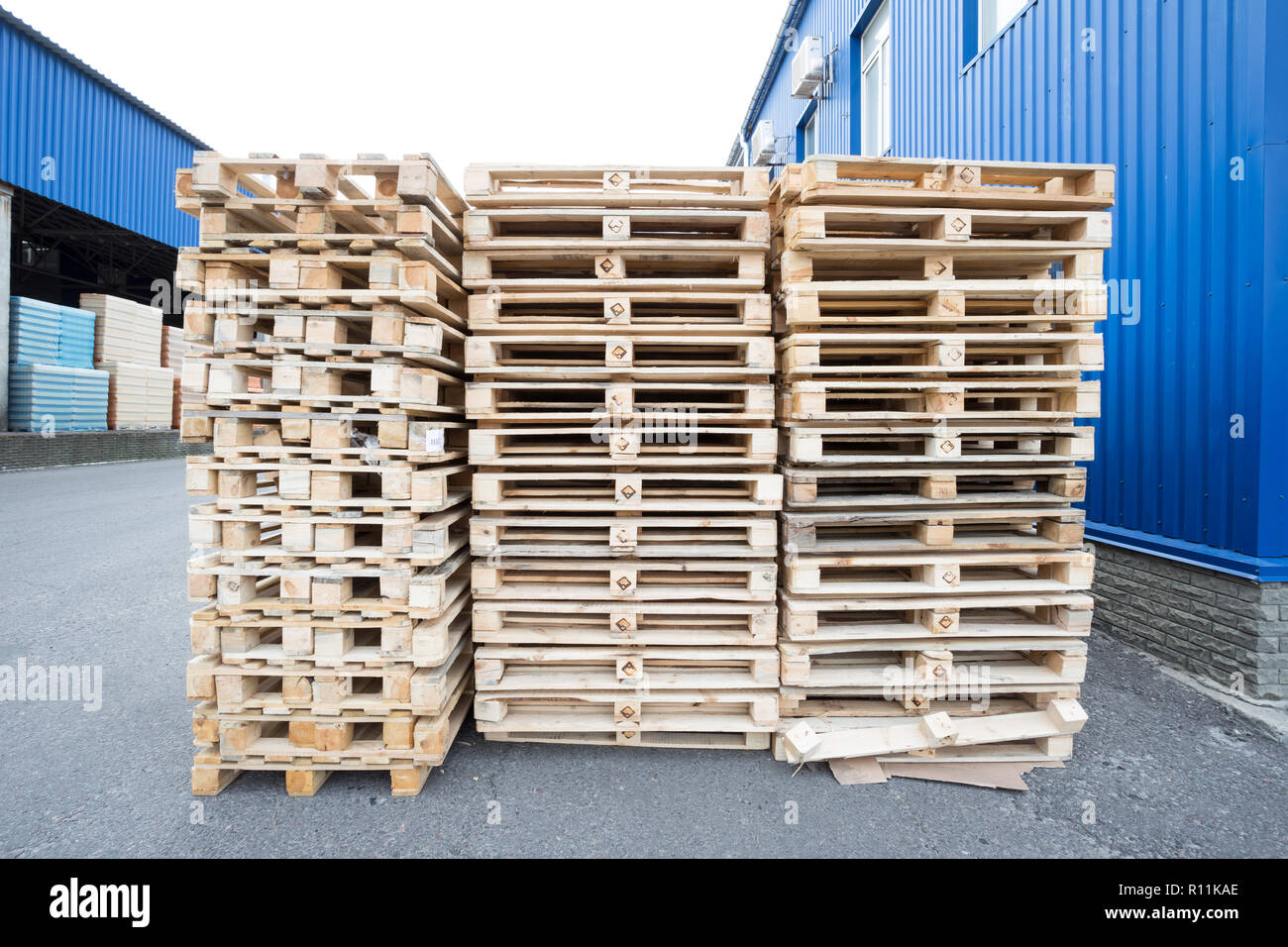 Stack of wooden pallets in stock Stock Photo - Alamy