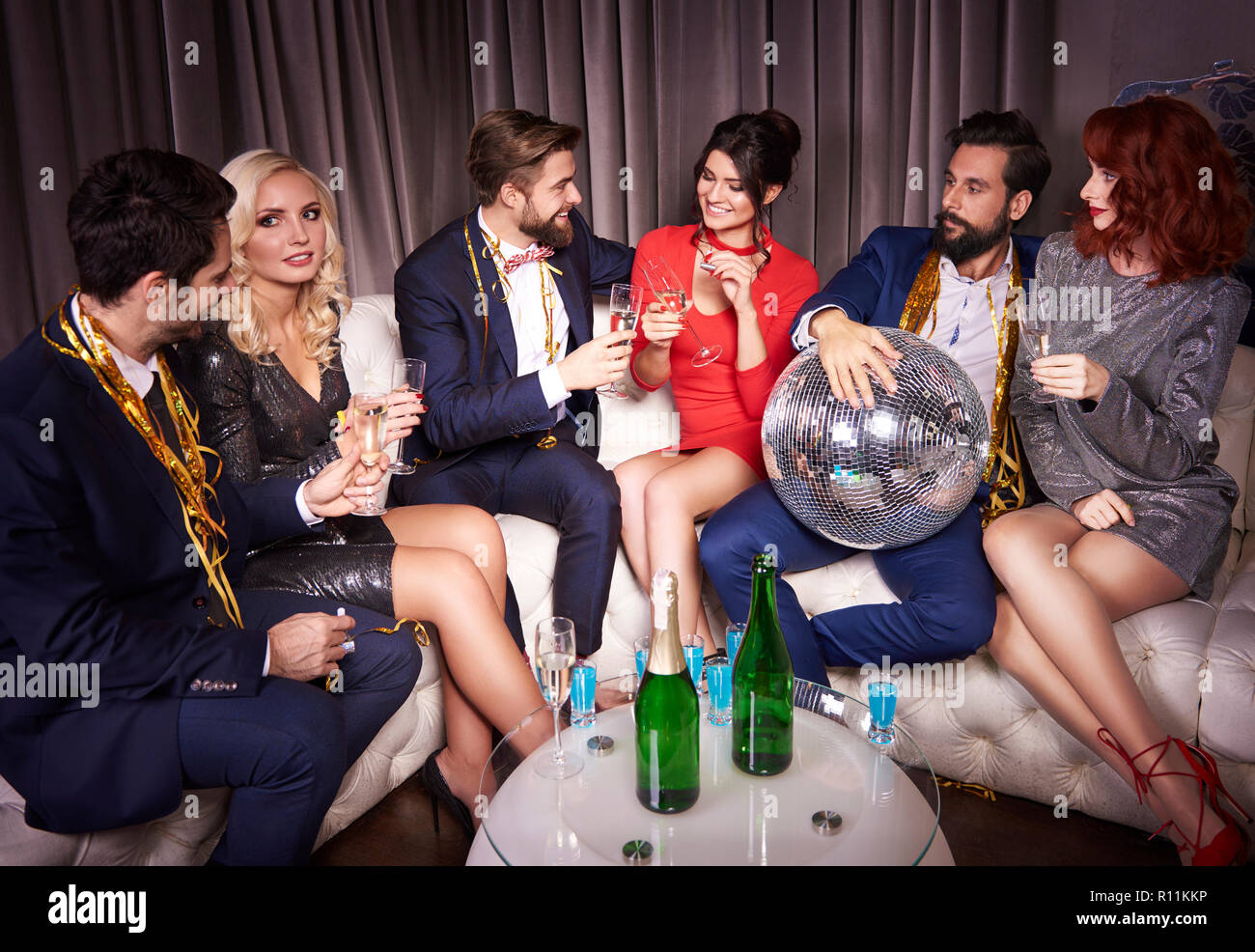 Happy people drinking champagne new years hi-res stock photography and ...