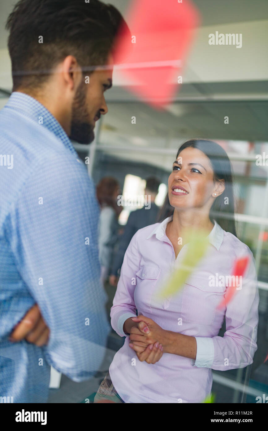 Corporate teamworking young colleagues in modern office Stock Photo - Alamy