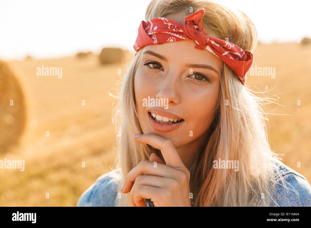 Beautiful young blonde girl in headband at the wheat field Stock Photo ...