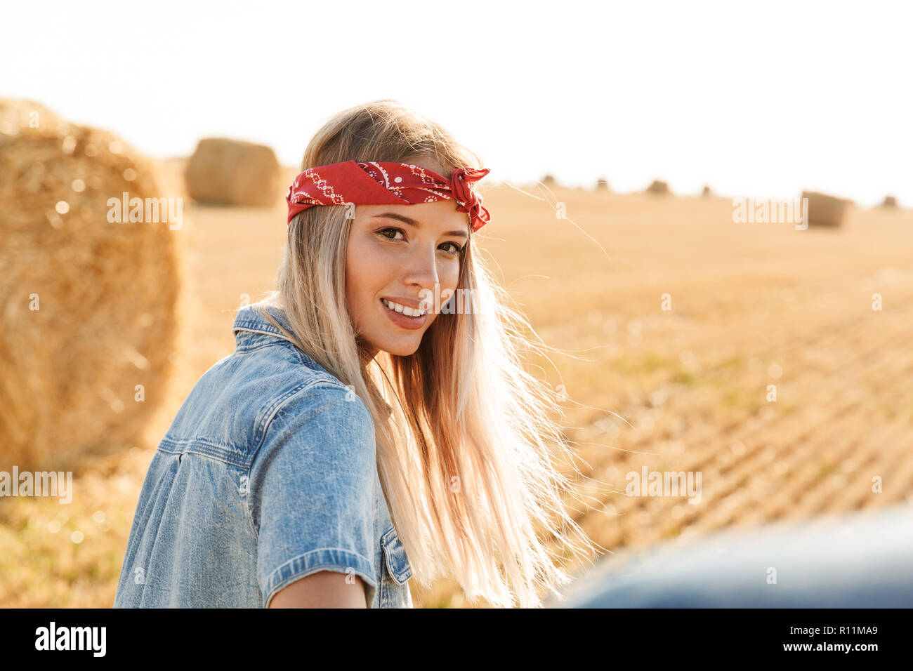 Image of amazing young cute loving couple standing on the field walking ...