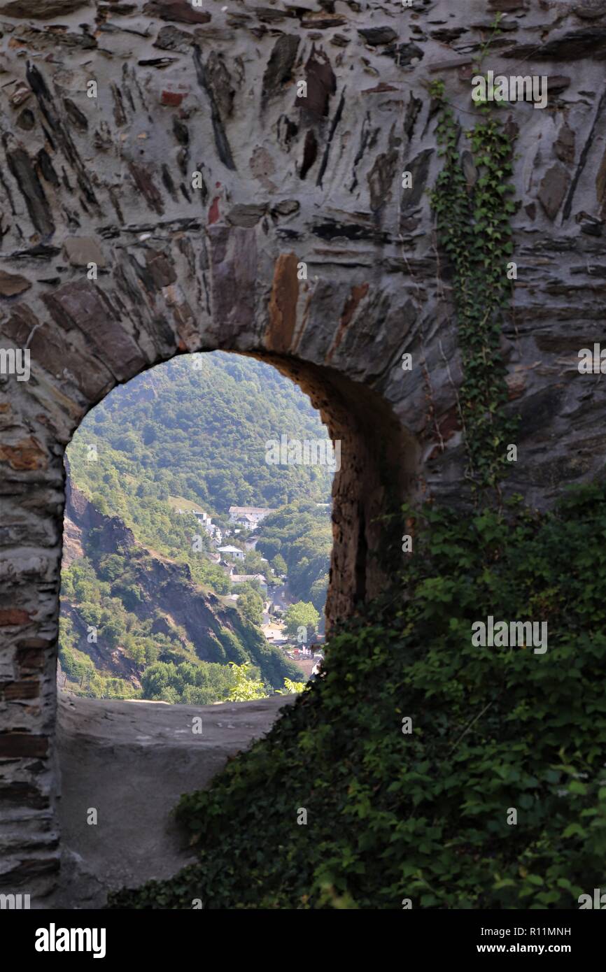Viewing a German village through a castle archway Stock Photo - Alamy