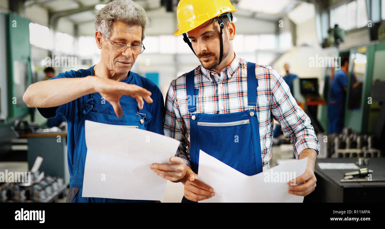 Portrait of an handsome engineer in a factory Stock Photo - Alamy