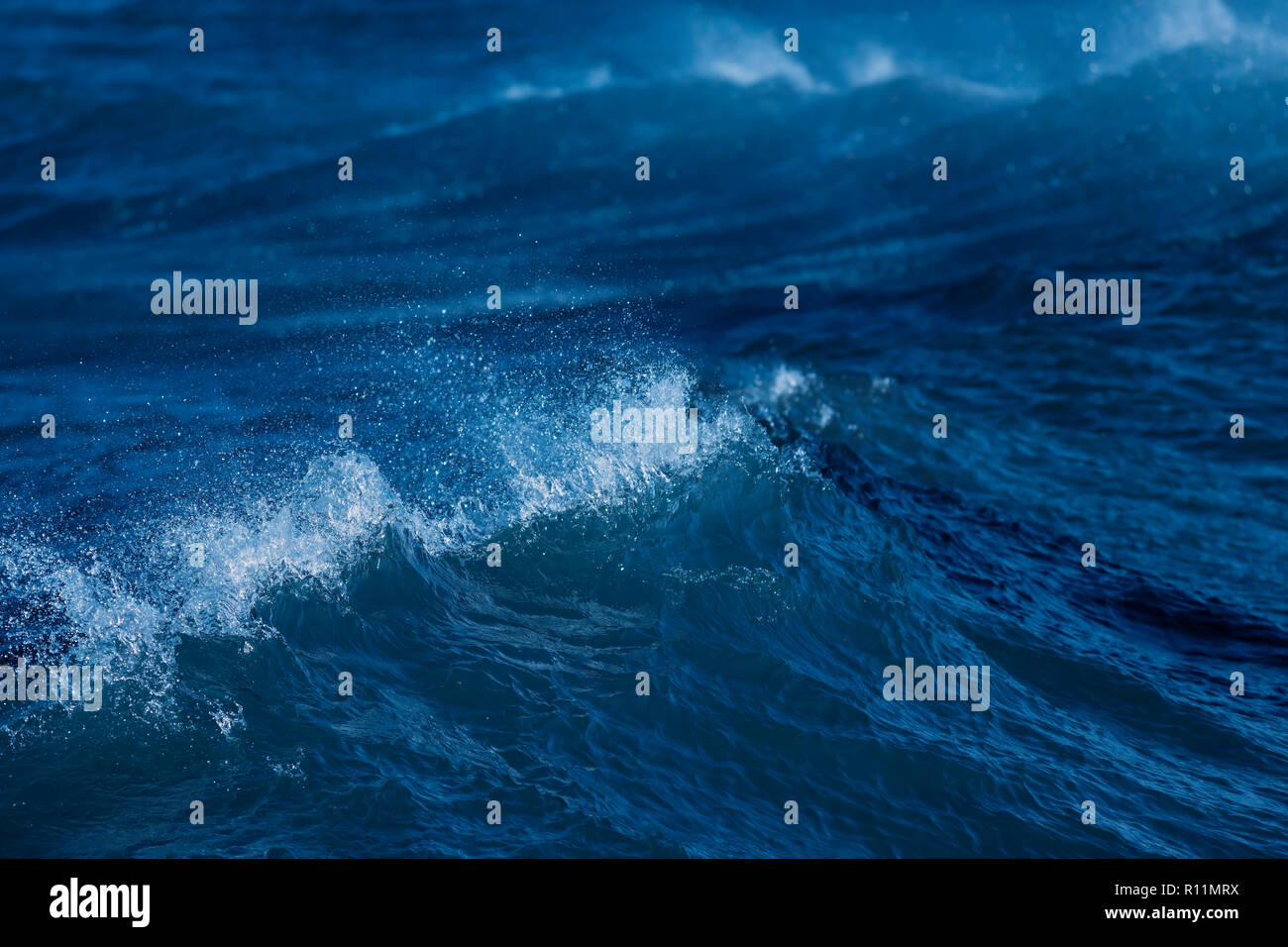 Surf with the wind in the sea background Stock Photo - Alamy