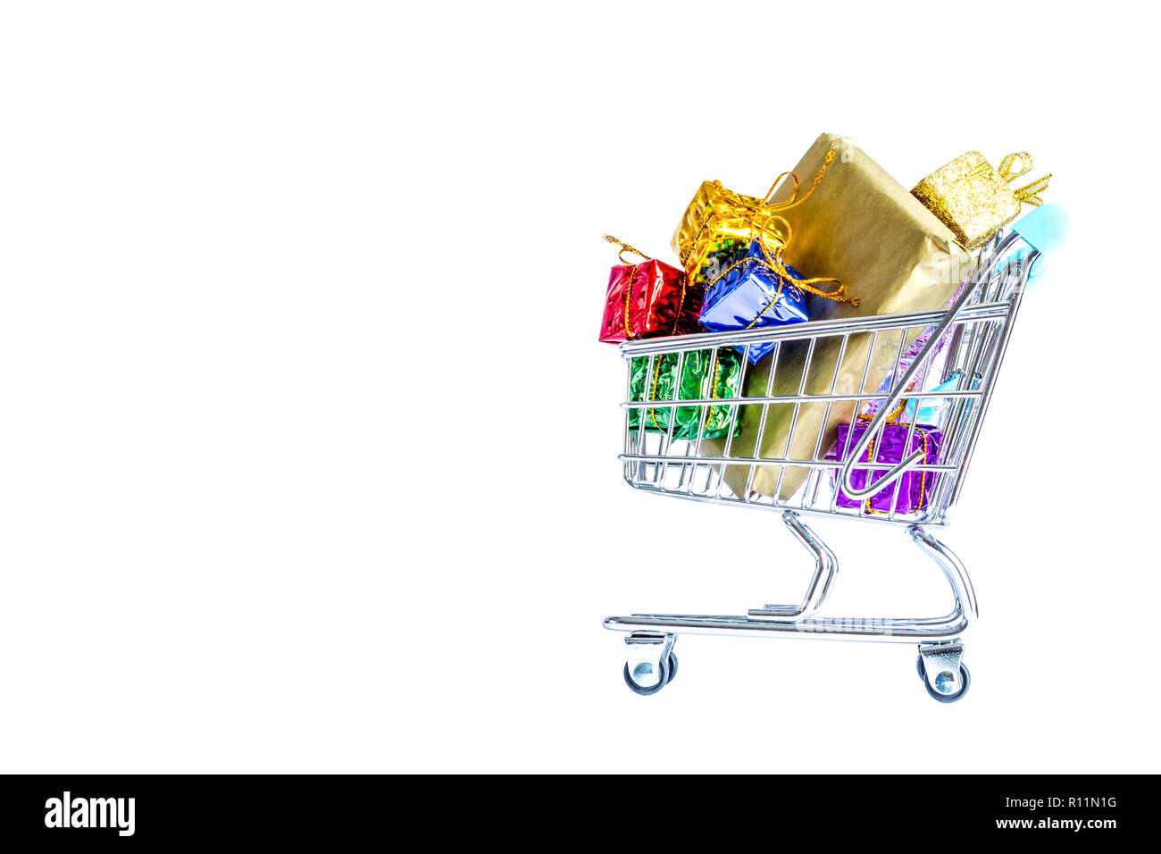Shopping carts, trolley with boxes of colorful gifts isolated on white ...