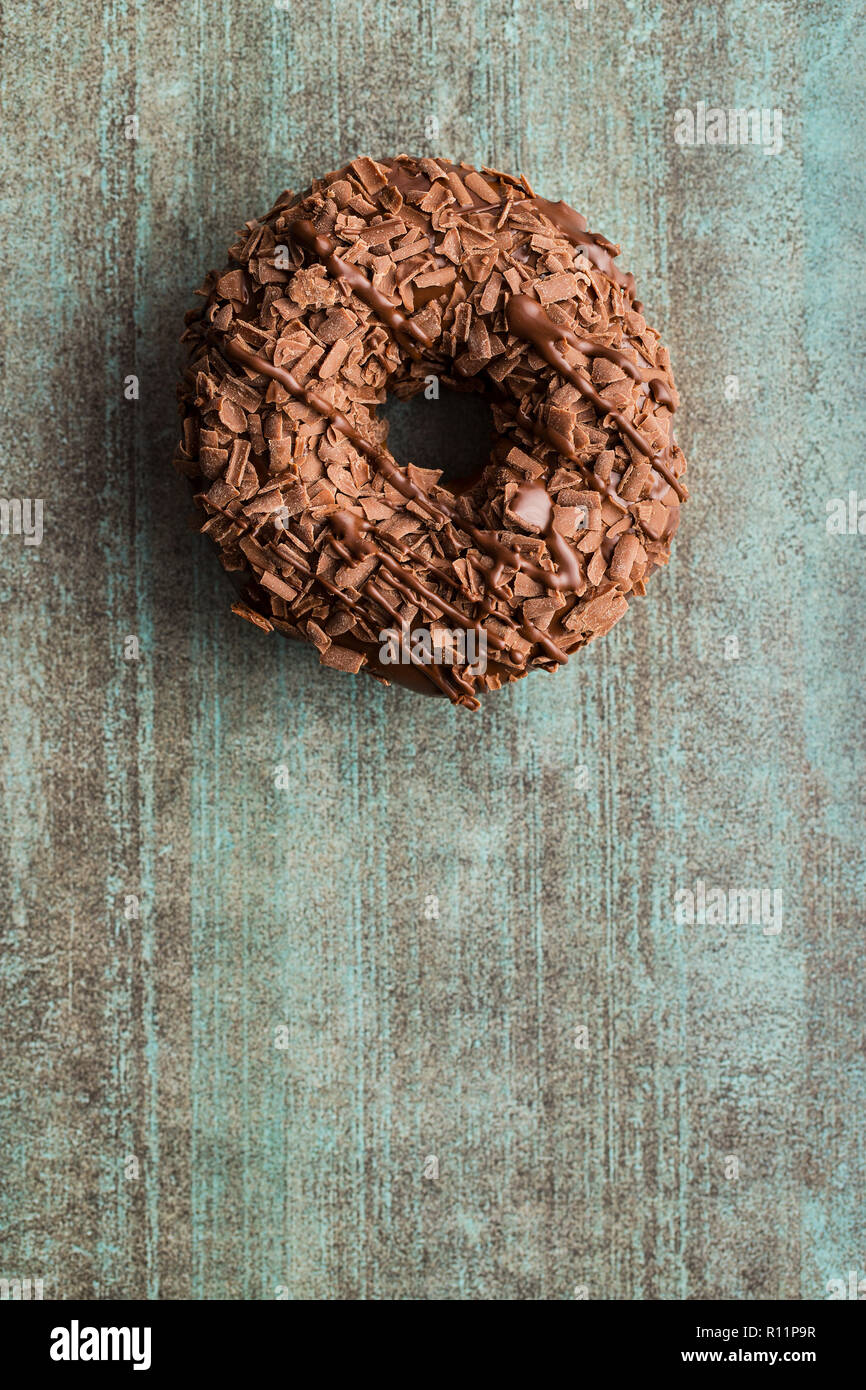 Sweet glazed donut on old kitchen table Stock Photo - Alamy