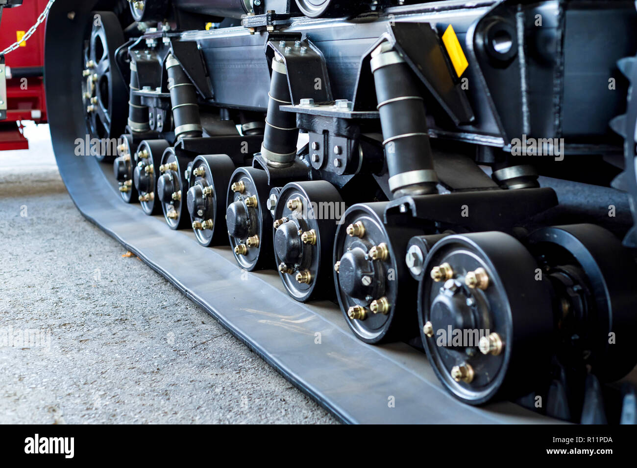 A close up of modern rubber tractor tracks Stock Photo - Alamy