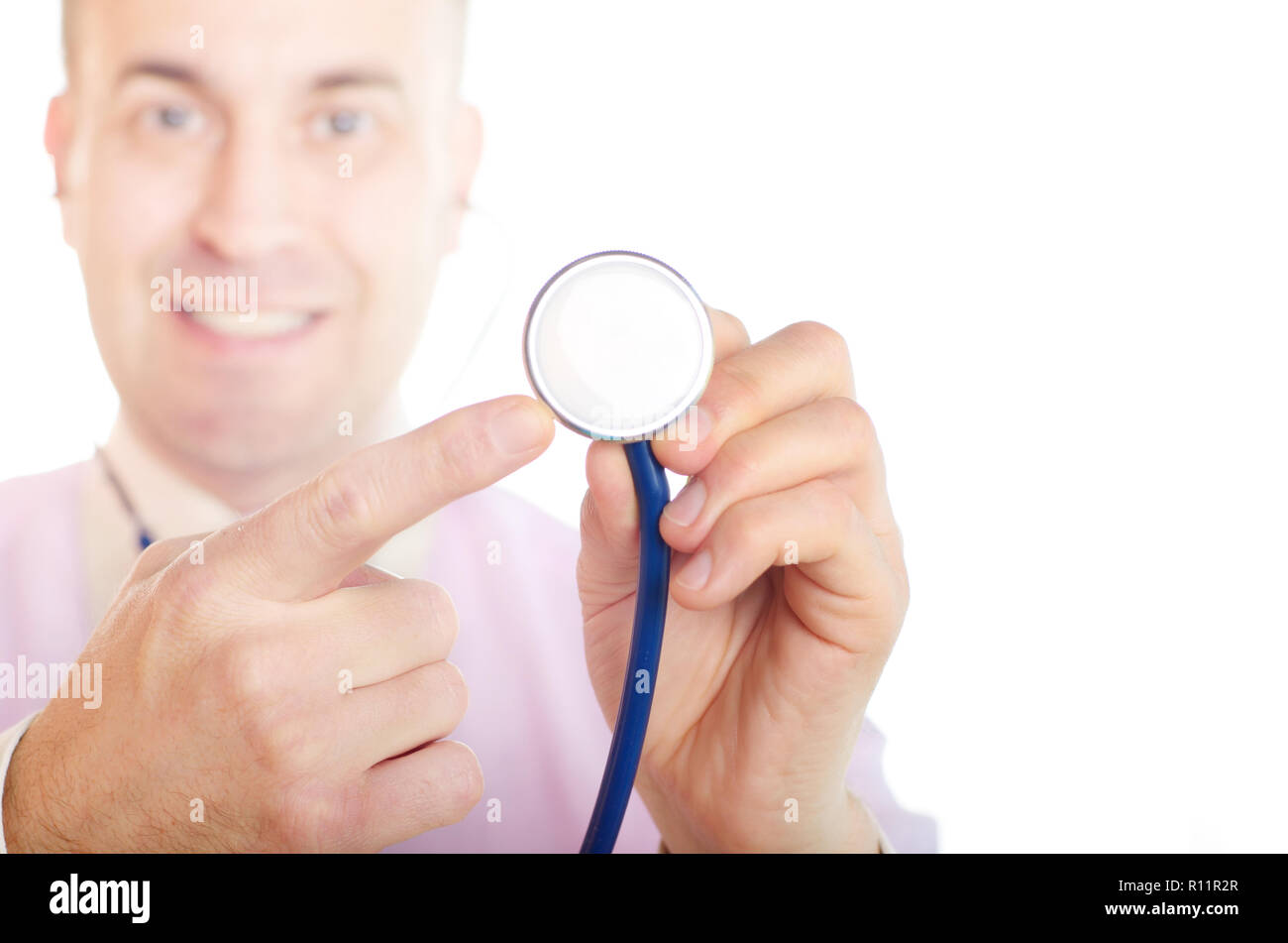 Doctor with a stethoscope bell in his hand on white background Stock ...