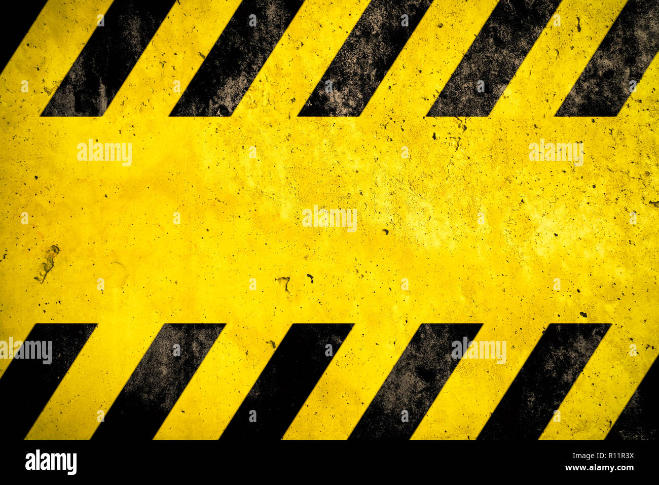 Warning background with yellow and black stripes painted over yellow ...