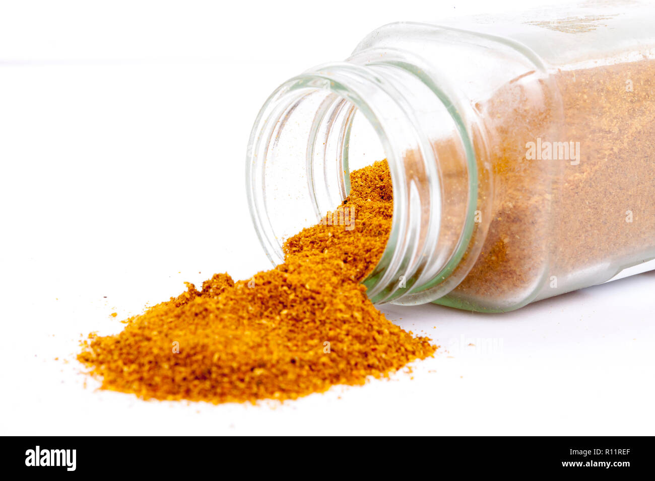 A still life with dried spices spilling from glass jars Stock Photo - Alamy