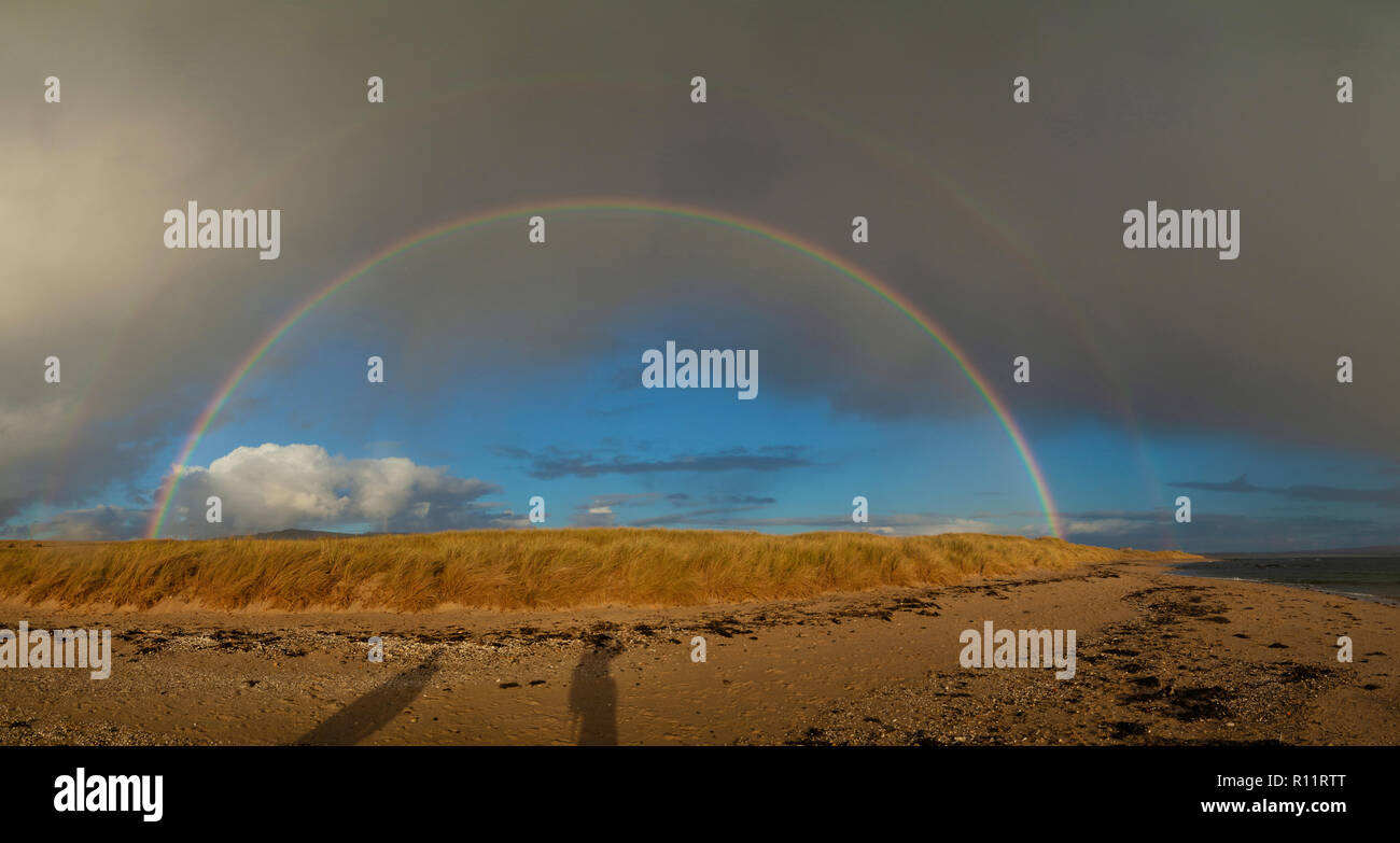 A full rainbow seen along the beach near Elie Fife Scotland Stock Photo ...
