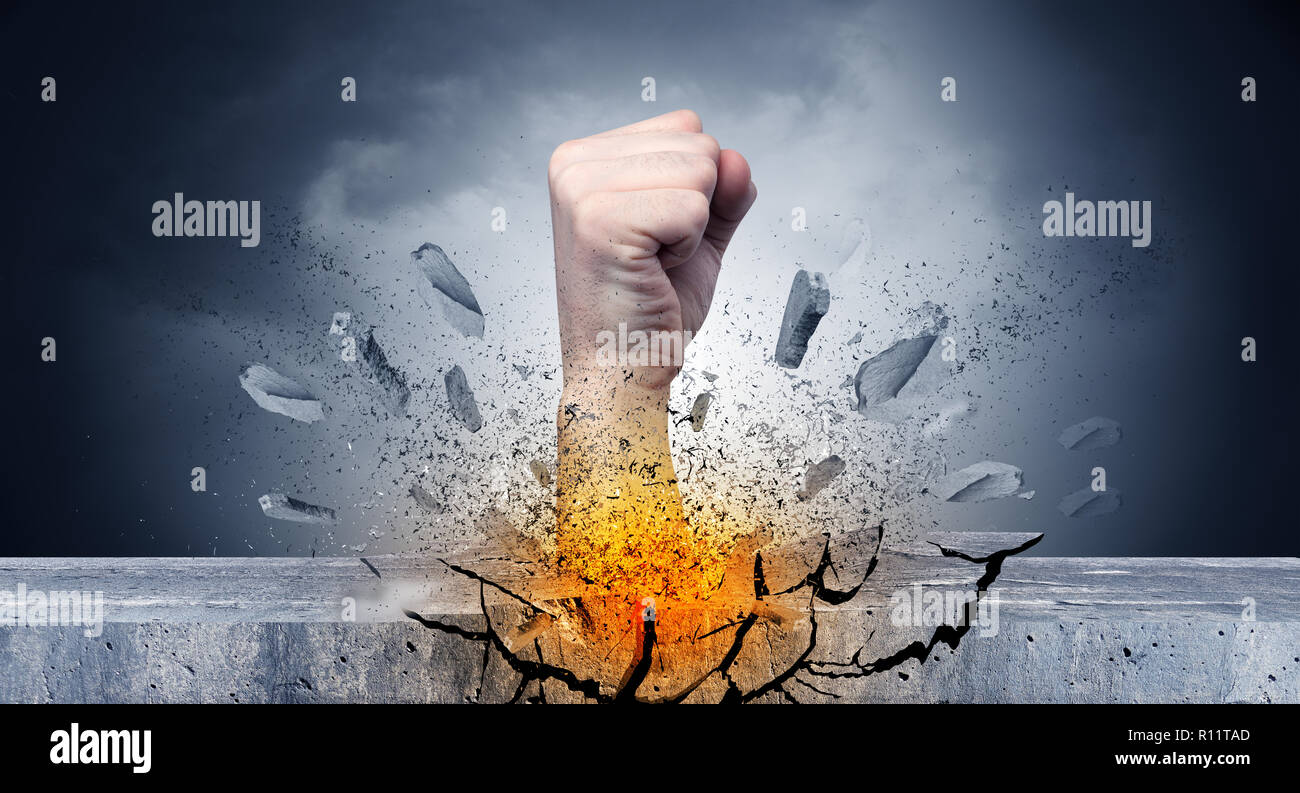 Big hand hits intense and breaks a crass stonewall Stock Photo - Alamy