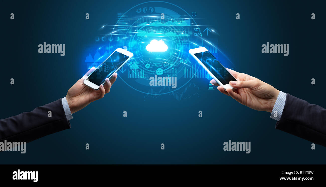 Two mobile phones syncing through the cloud Stock Photo - Alamy
