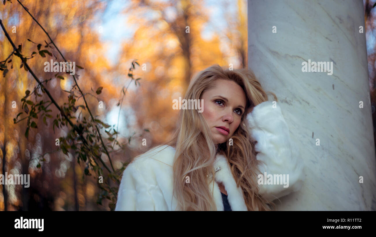 melancholy falling, scene of autumn and winter, beautiful blond woman ...