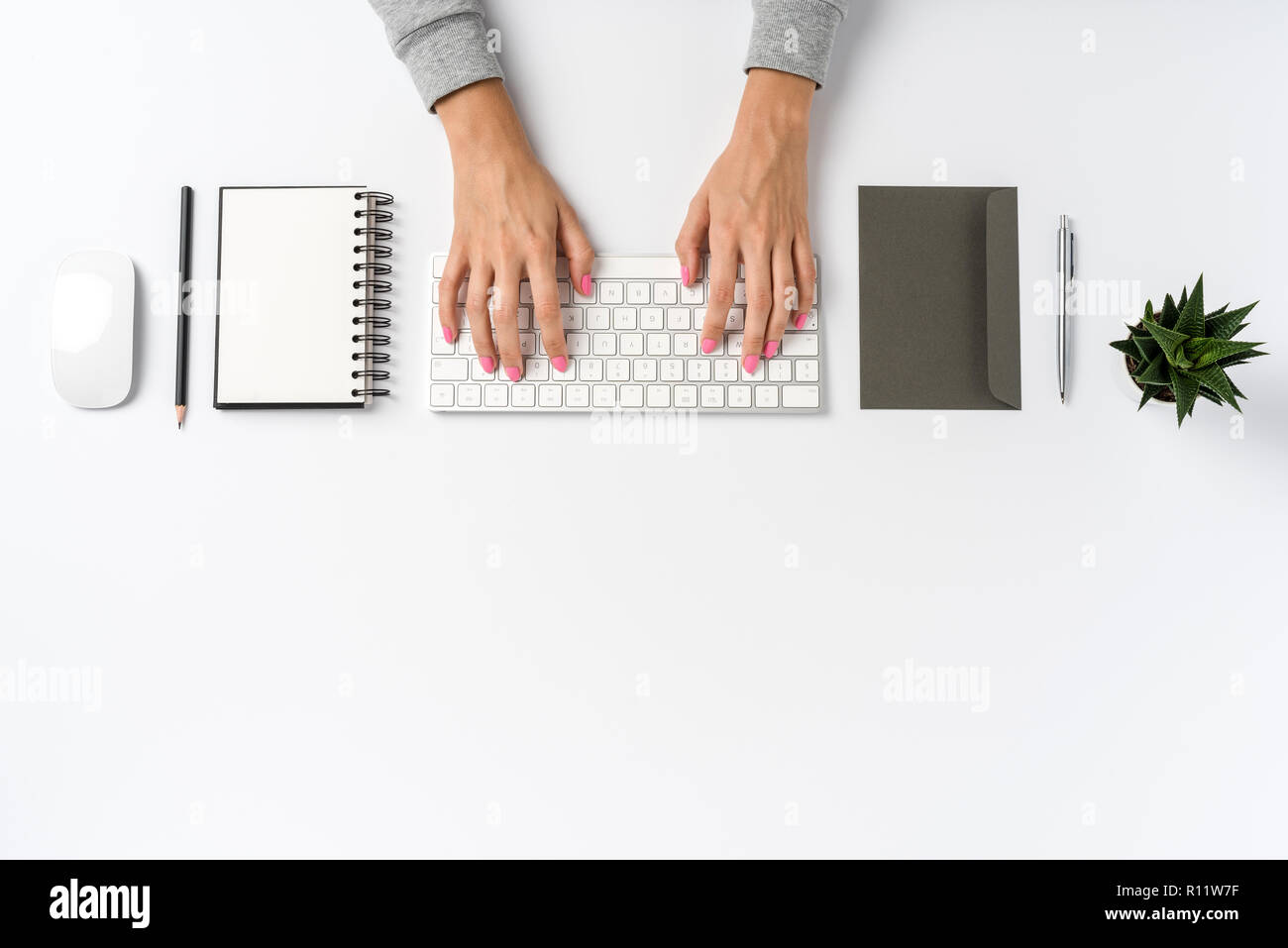 Woman using computer keyboard Stock Photo - Alamy