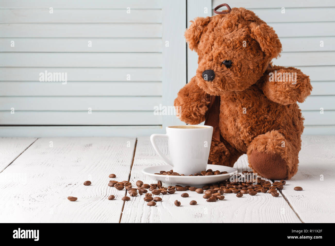 Teddy bear with cup of coffee Stock Photo - Alamy