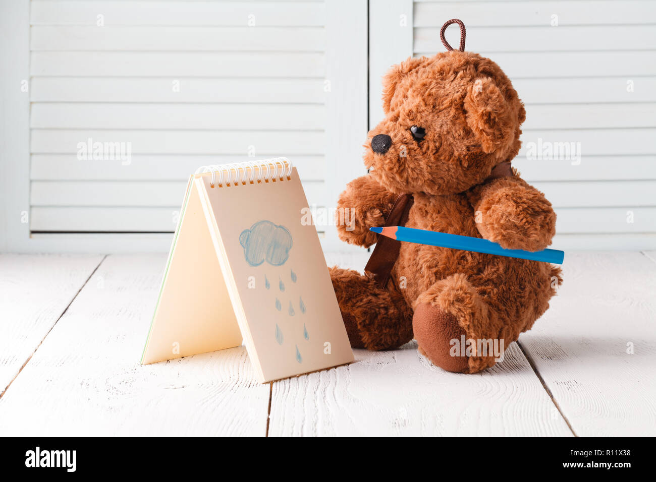 Teddy bear draw rainy weather sign Stock Photo - Alamy