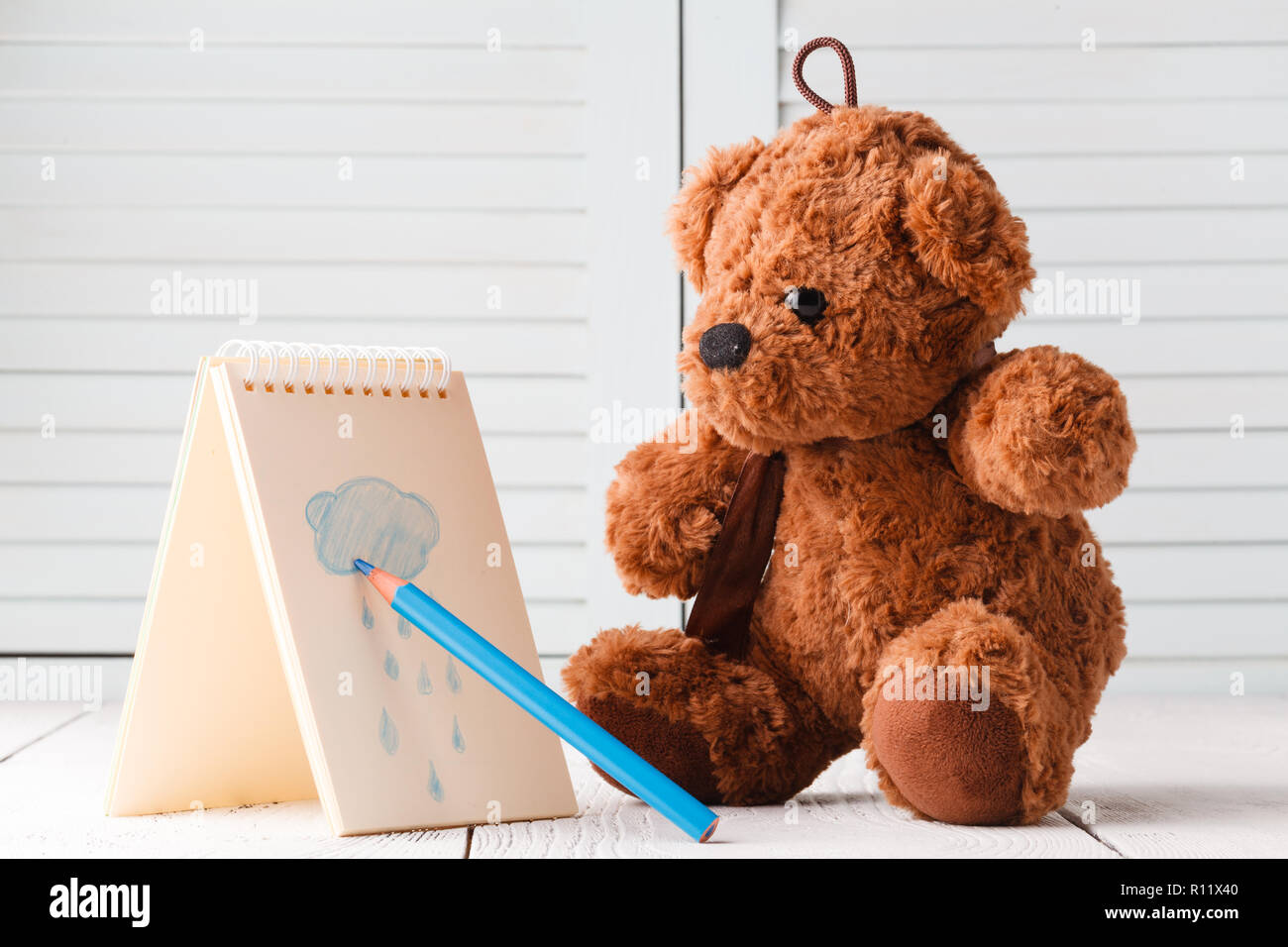 Teddy bear draw rainy weather sign Stock Photo - Alamy