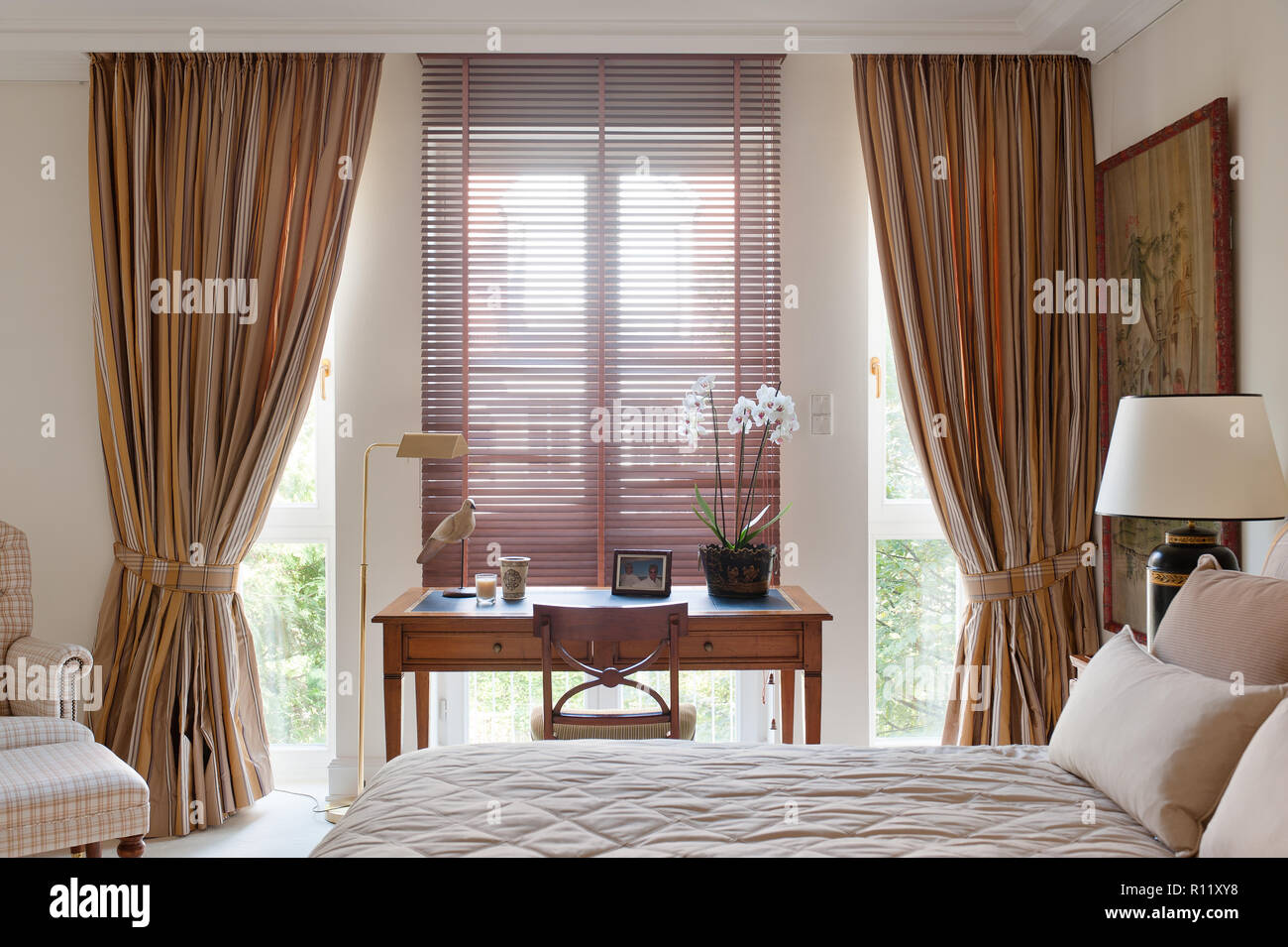 Desk by window in bedroom Stock Photo - Alamy