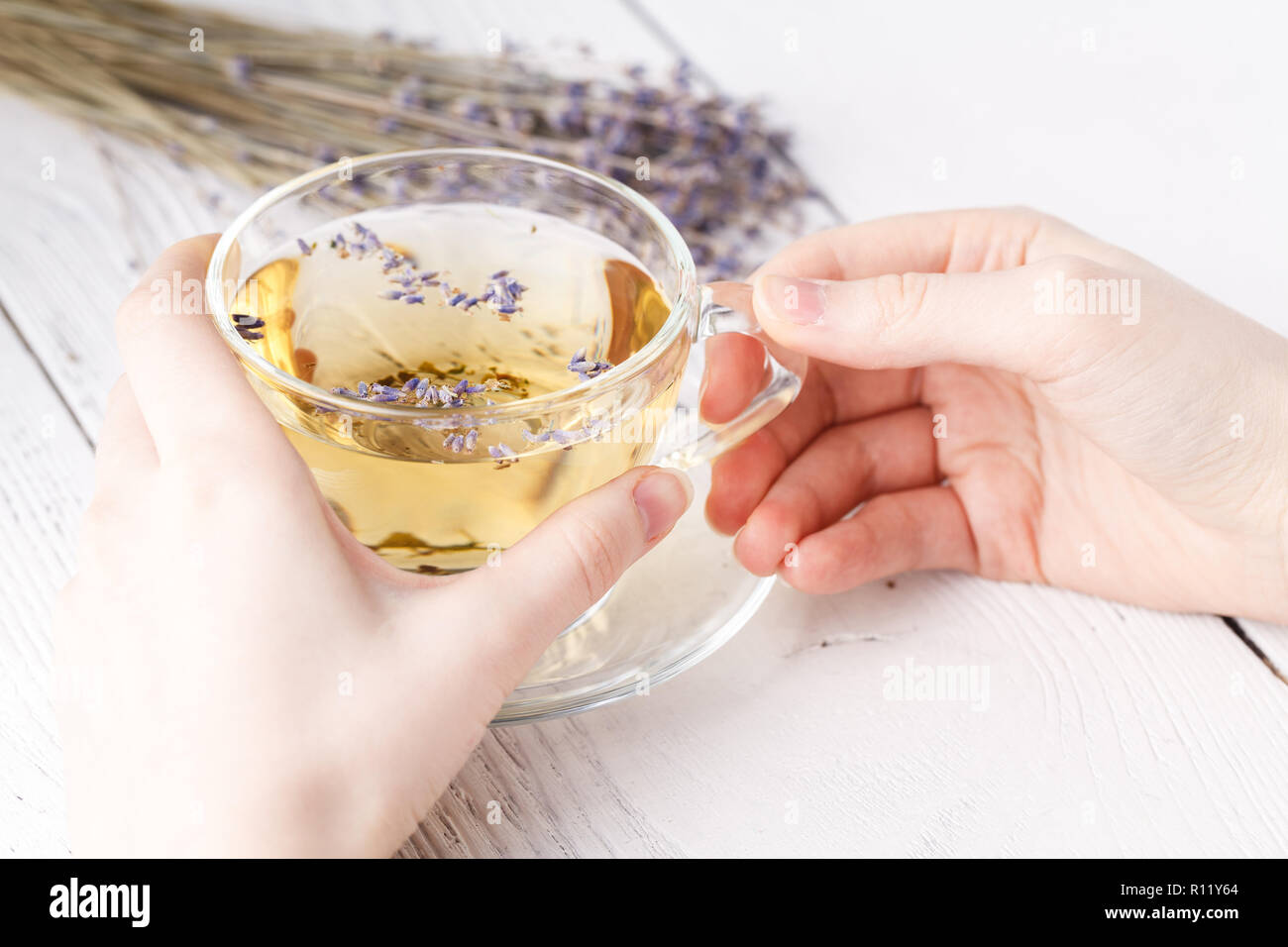 Female relax with cup of herbal tea Stock Photo - Alamy