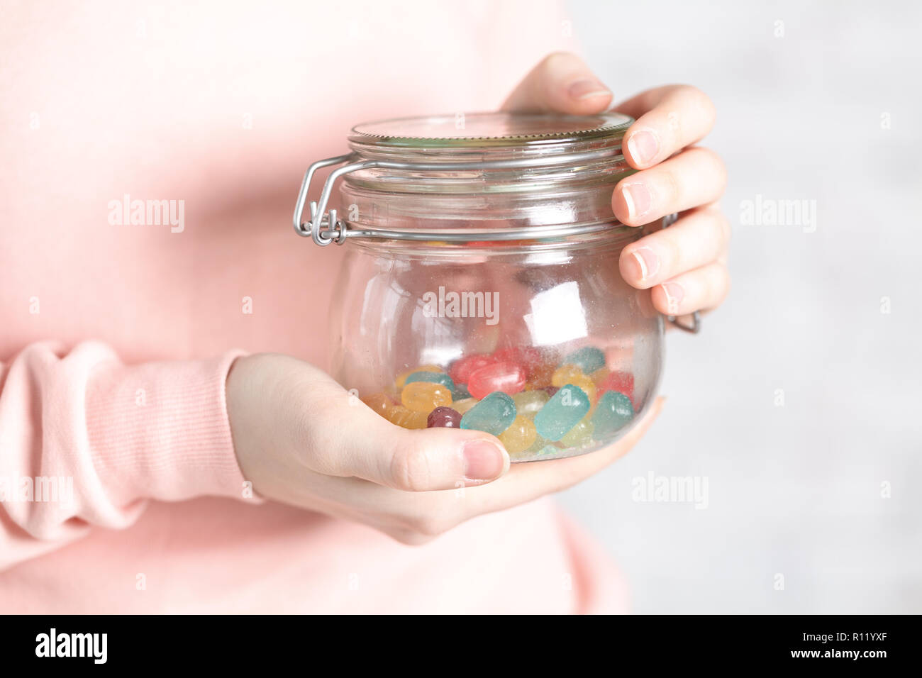 Female holg glass jar with jelly Stock Photo - Alamy