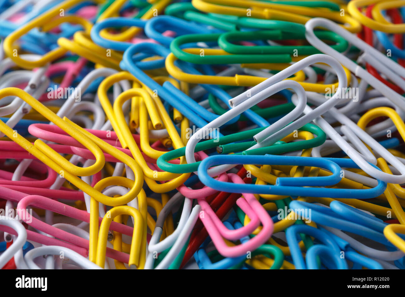 pile of colored office paper clips Stock Photo - Alamy